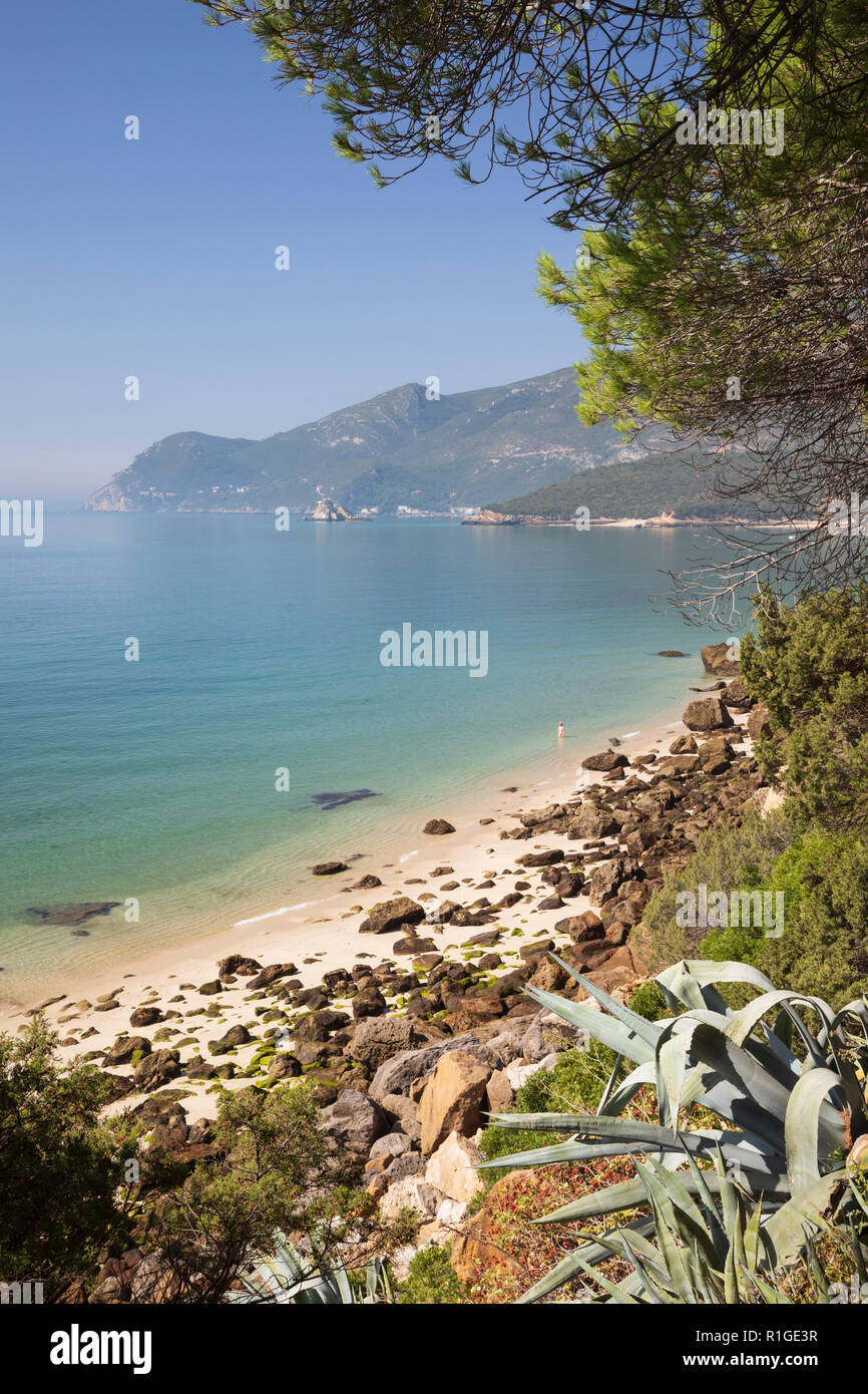 View over Galapos beach in summer morning sunshine, Portinho da ...