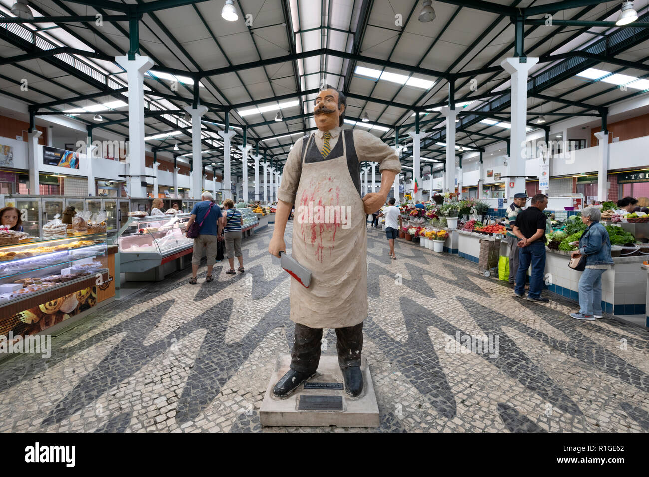 Statue of butcher inside the Mercado do Livramento taken in the morning ...