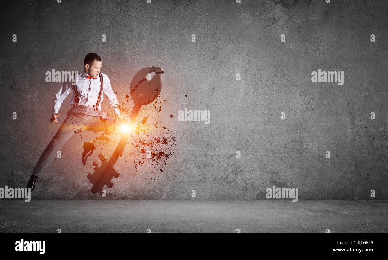 Breaking through access concept with furious man in room crashing ...