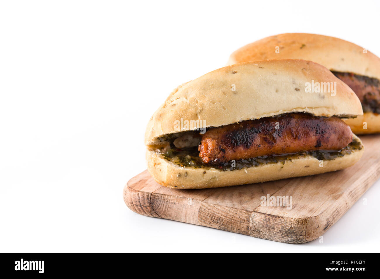 Choripan. Traditional Argentina sandwich with chorizo and chimichurri ...