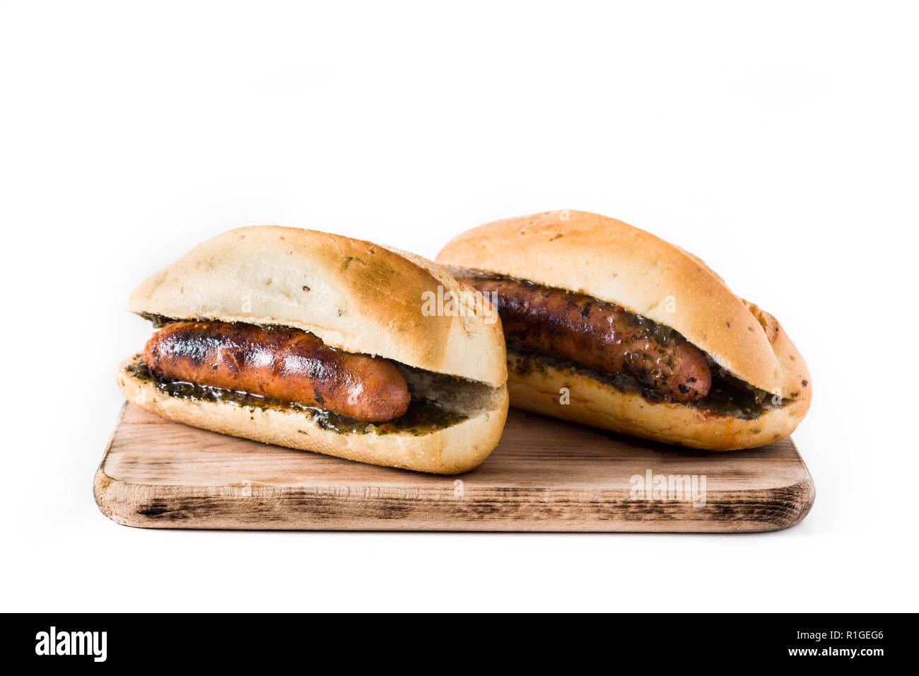 Choripan. Traditional Argentina sandwich with chorizo and chimichurri ...