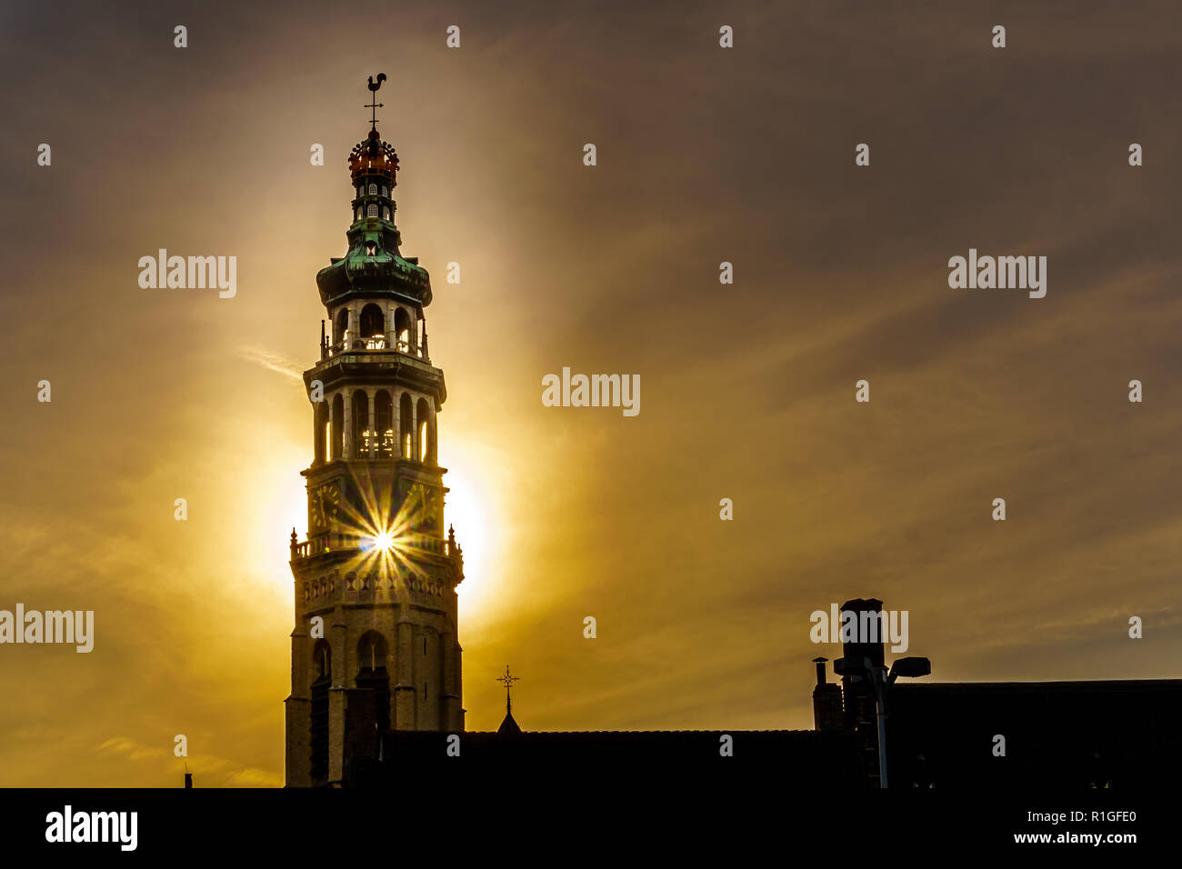 Sun rays through the Lange Jan Toren (Long John Tower) of the medieval ...