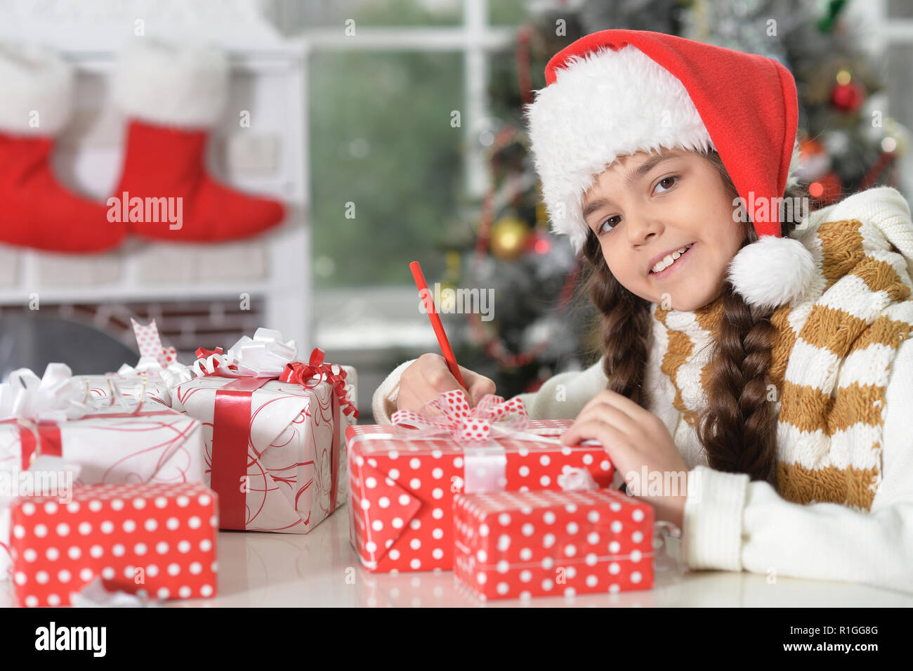 Portrait of a little girl writing letter Stock Photo - Alamy