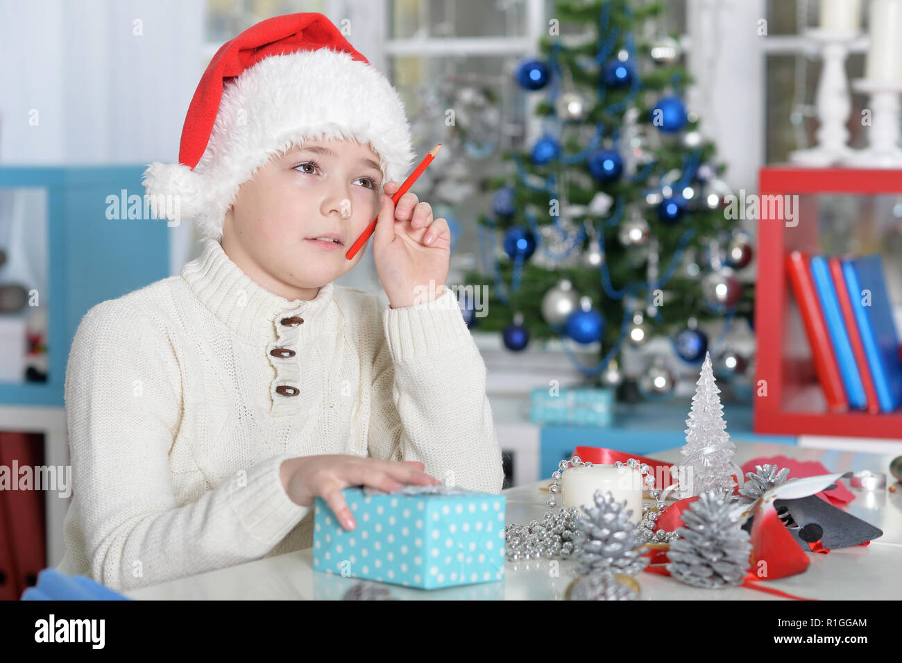 Portrait of happy little boy writing letter Stock Photo - Alamy