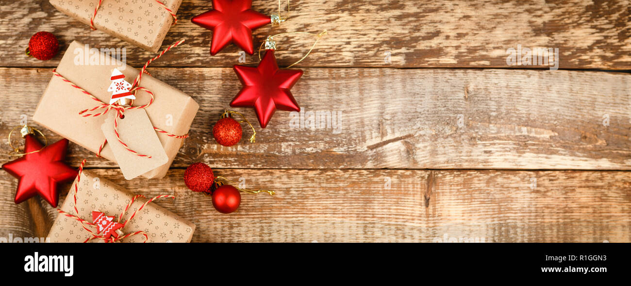 Christmas background with red decorations stars and balls and gift ...