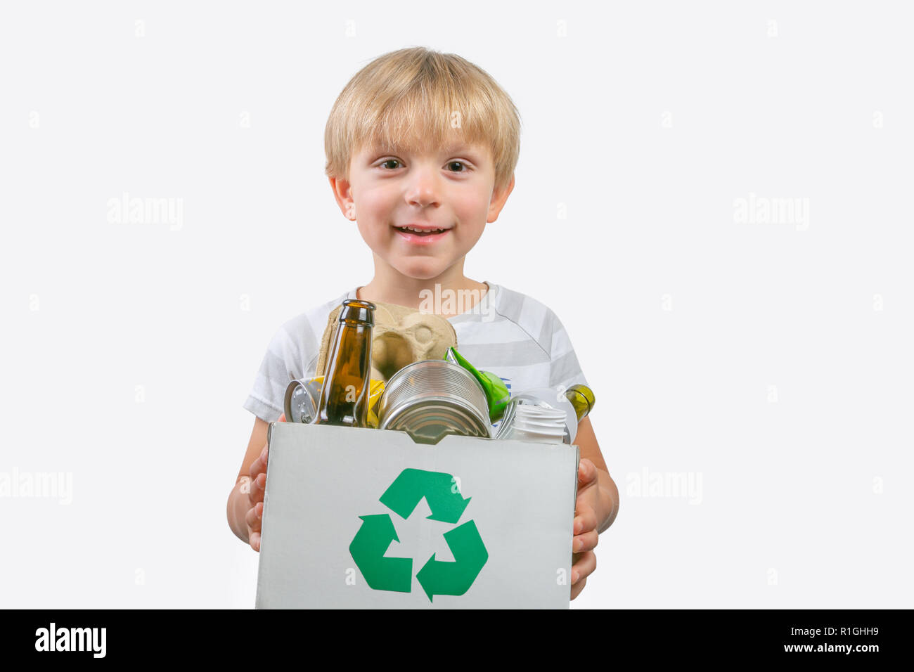 Boy holds box with recyclable materials Stock Photo - Alamy