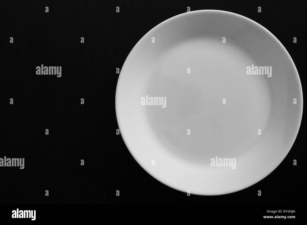 Empty wooden plate Black and White Stock Photos & Images - Alamy