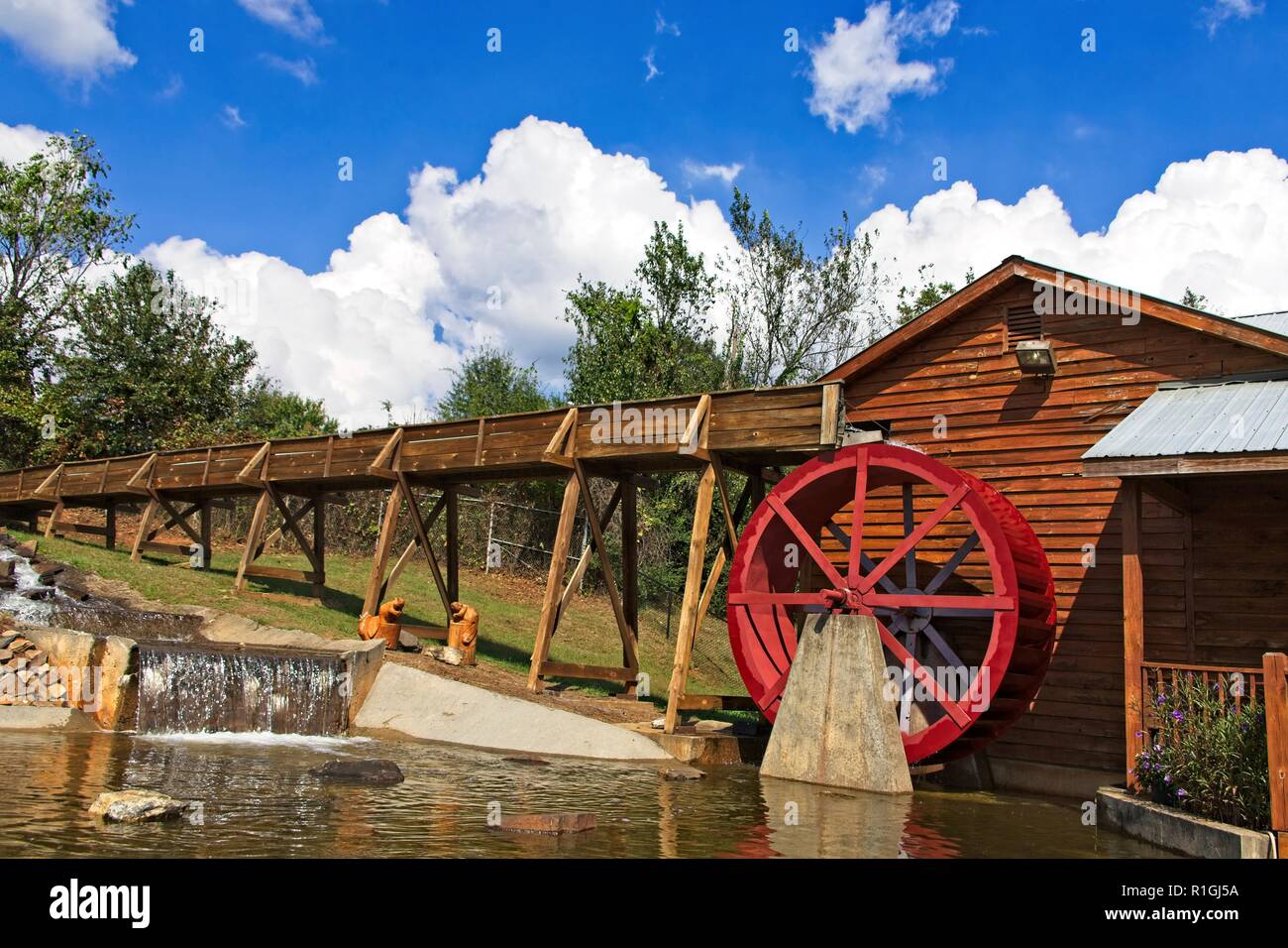 A Red Water Wheel at an Old Mill Stock Photo - Alamy