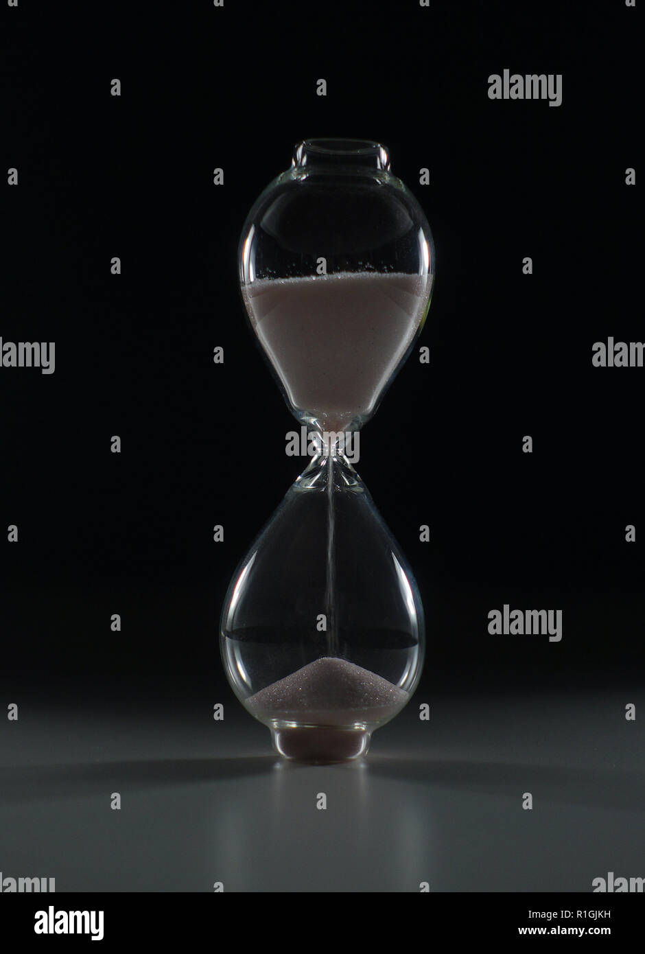 Photo of a isolated hourglass: an ancient clock, an instrument for ...