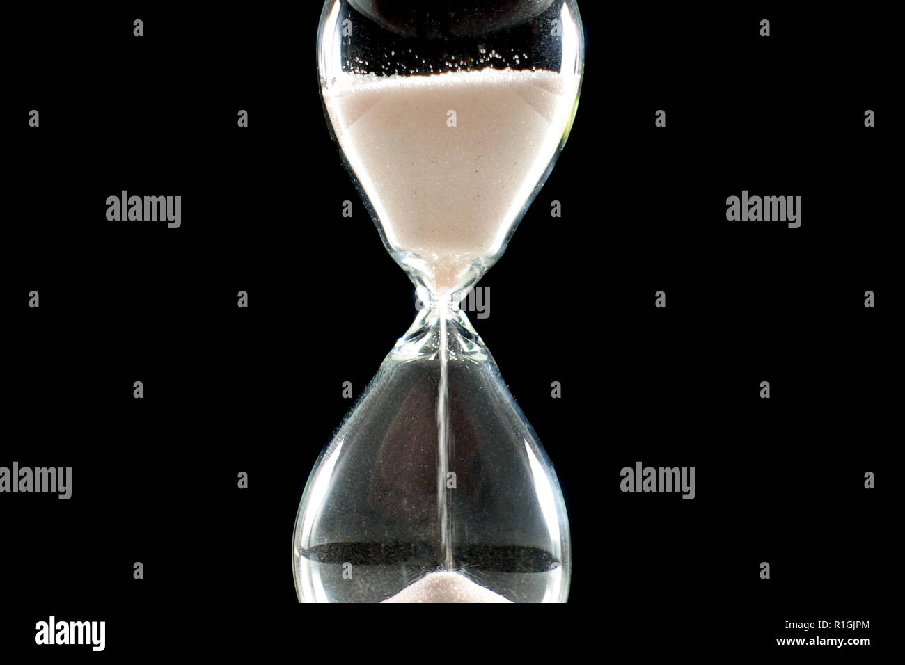 Photo of a isolated hourglass: an ancient clock, an instrument for ...