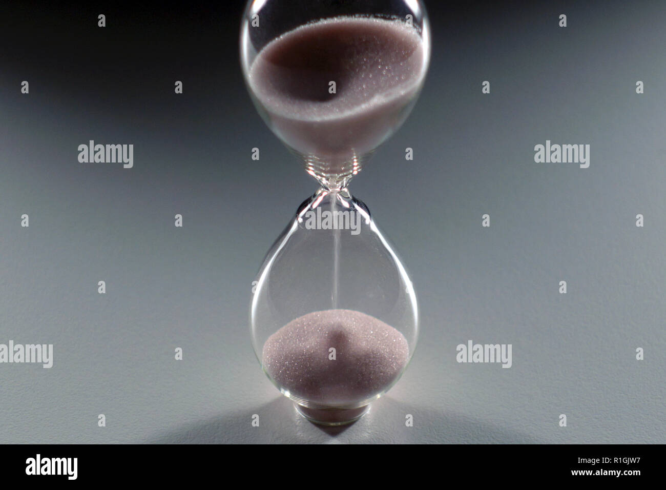 Photo of a isolated hourglass: an ancient clock, an instrument for ...