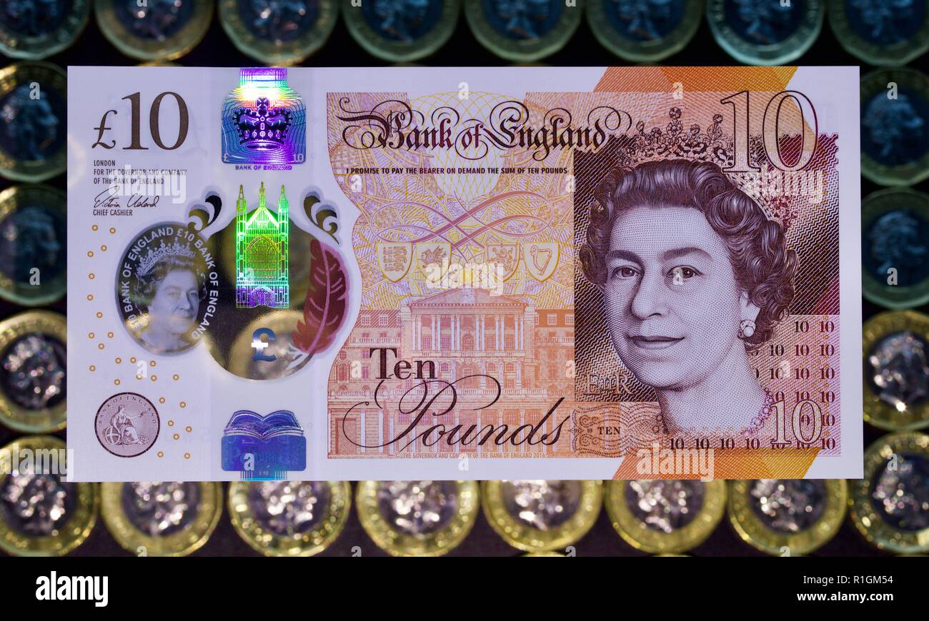 The new polymer £10 note, featuring Jane Austen, with the new £1 coins ...