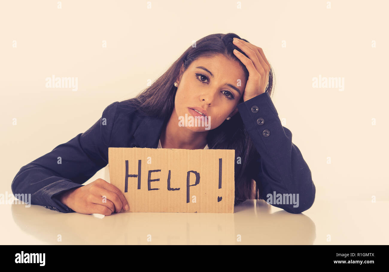 Young beautiful latin business woman overwhelmed and tired holding a ...