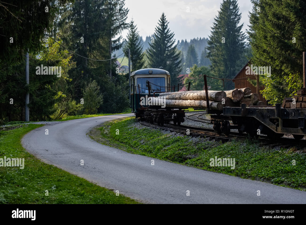 ancient log wood railway and train on the tracks. tourist attraction ...
