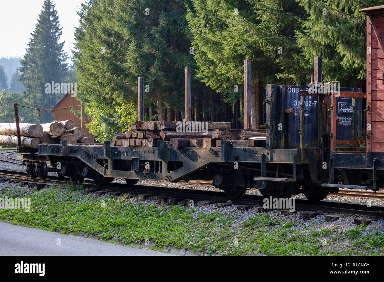 ancient log wood railway and train on the tracks. tourist attraction ...