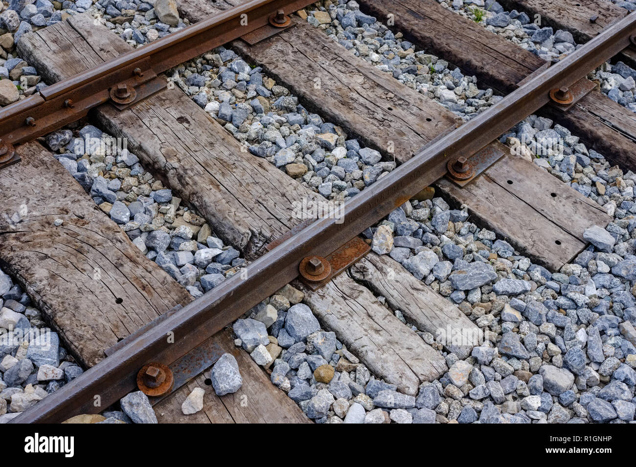 ancient log wood railway and train on the tracks. tourist attraction ...