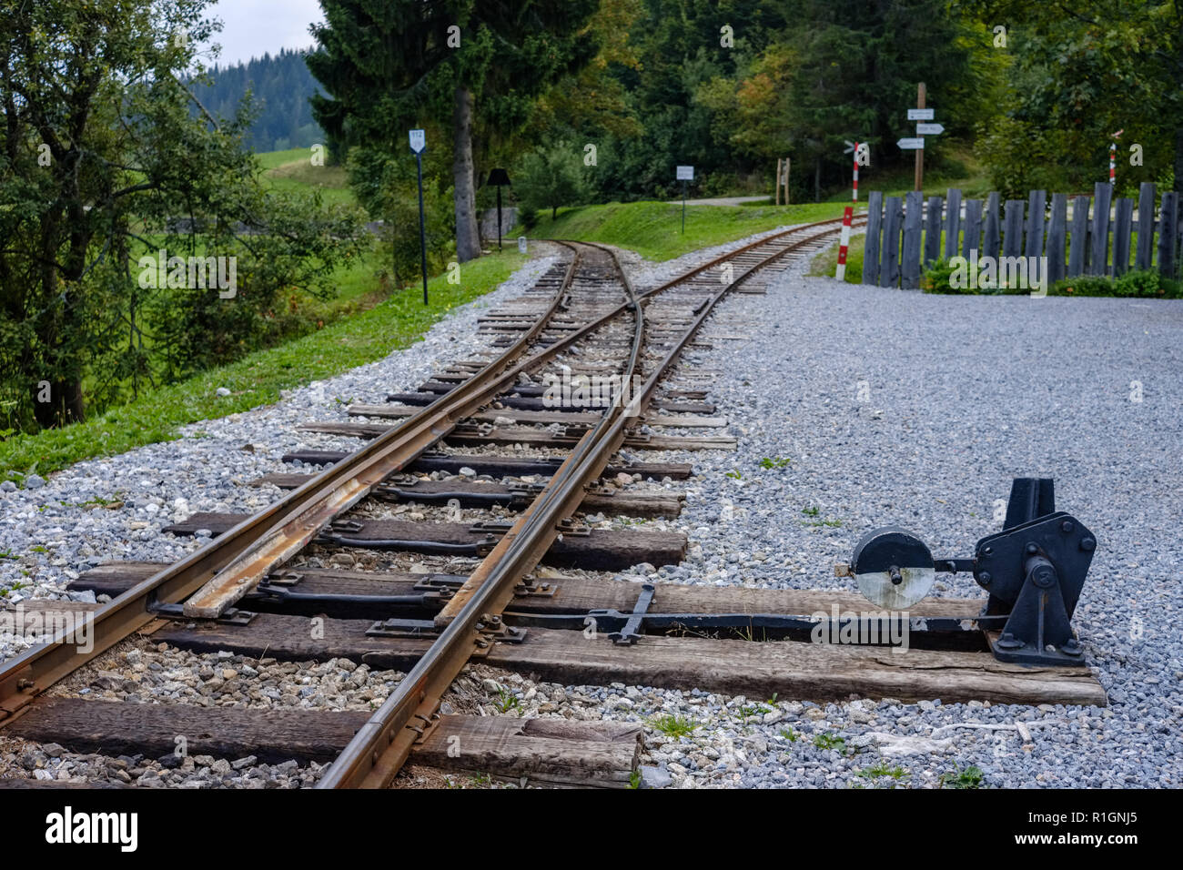 ancient log wood railway and train on the tracks. tourist attraction ...