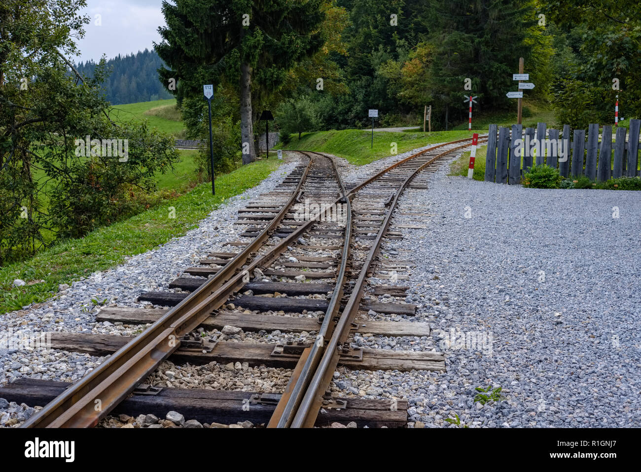 ancient log wood railway and train on the tracks. tourist attraction ...