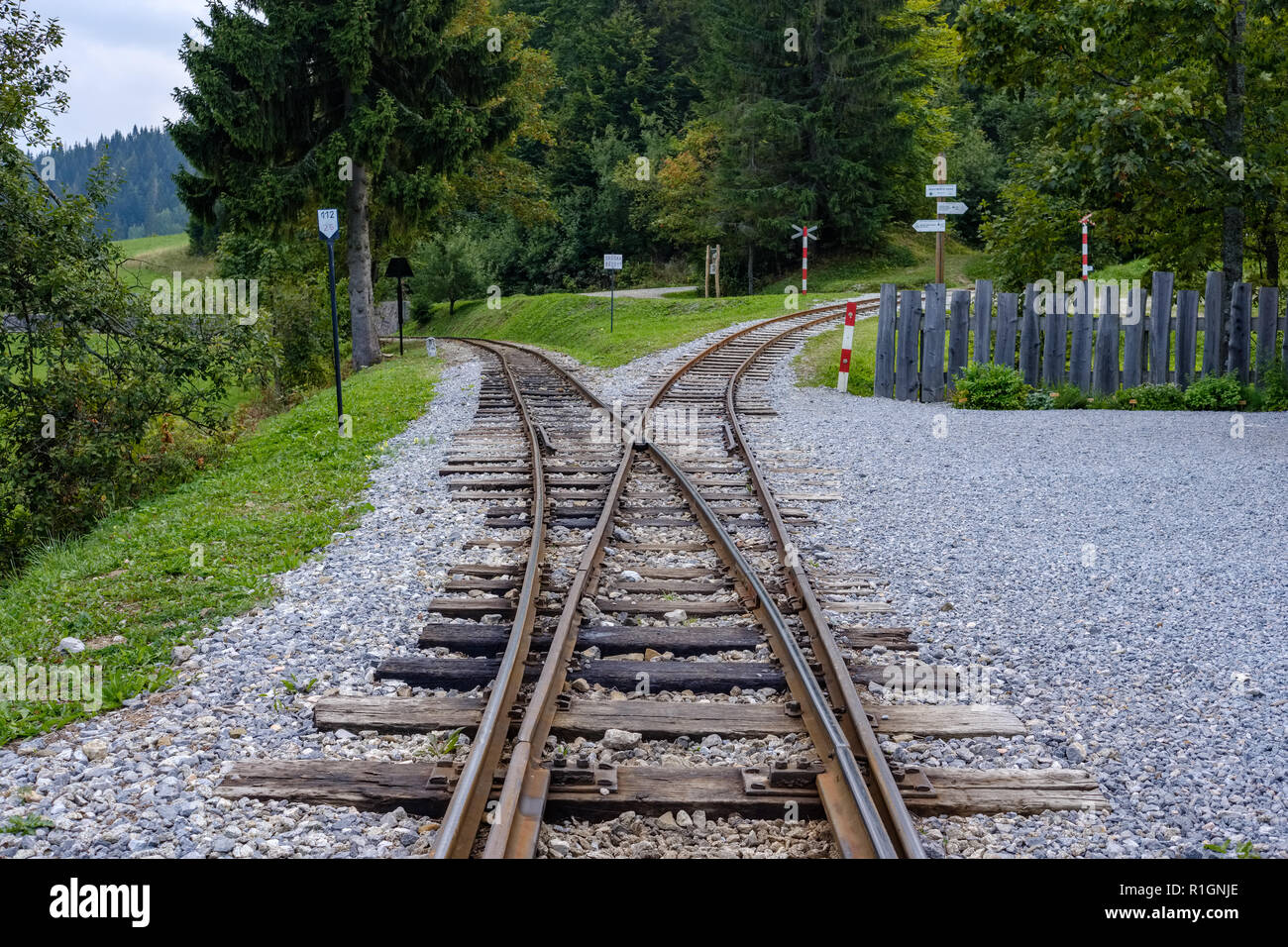 ancient log wood railway and train on the tracks. tourist attraction ...