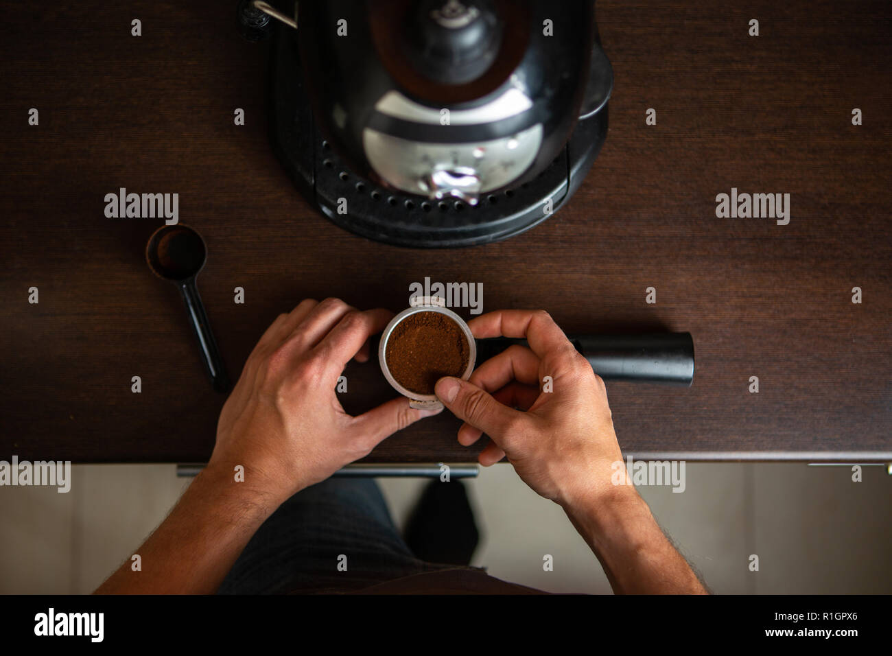 Photo of coffee maker, man hand pouring coffee Stock Photo - Alamy