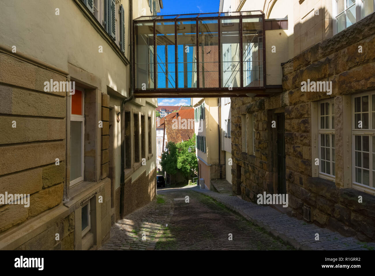 a connection between two buildings above the street Stock Photo - Alamy