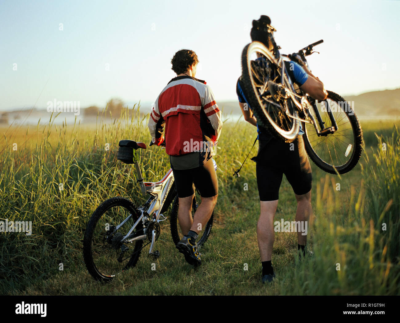 Sport cycling men walking bikes hi-res stock photography and images - Alamy