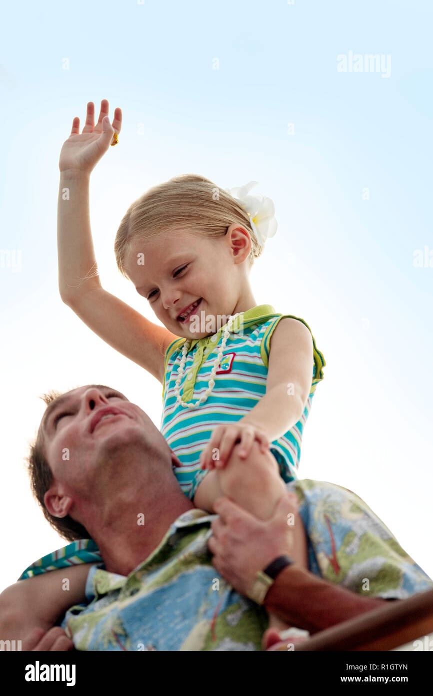 Young girl getting a shoulder ride from her dad Stock Photo - Alamy