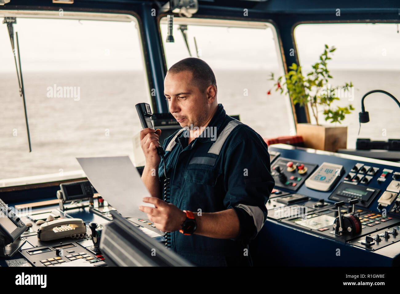 Marine navigational officer is reporting by VHF radio Stock Photo - Alamy