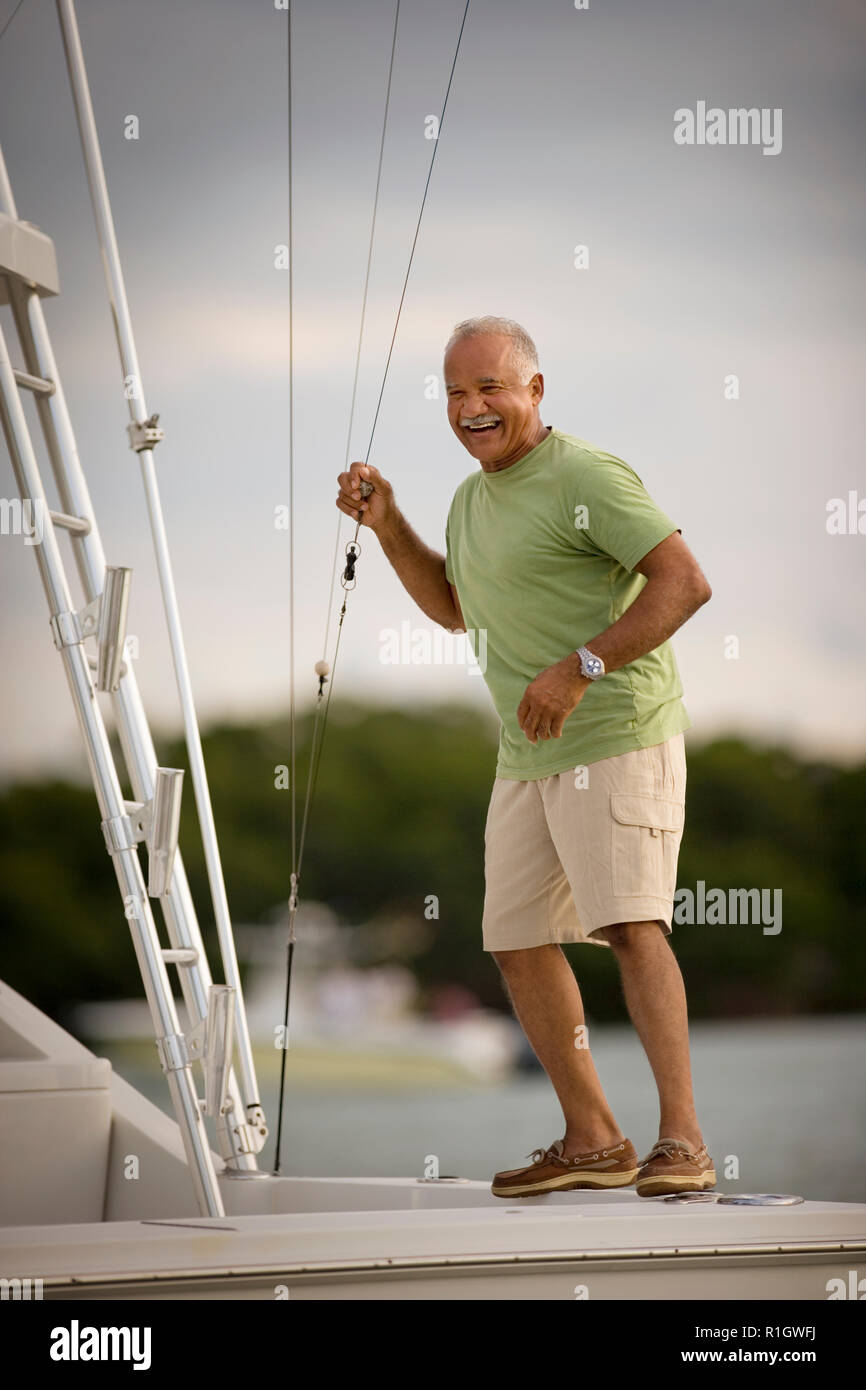 man on a boat Stock Photo - Alamy