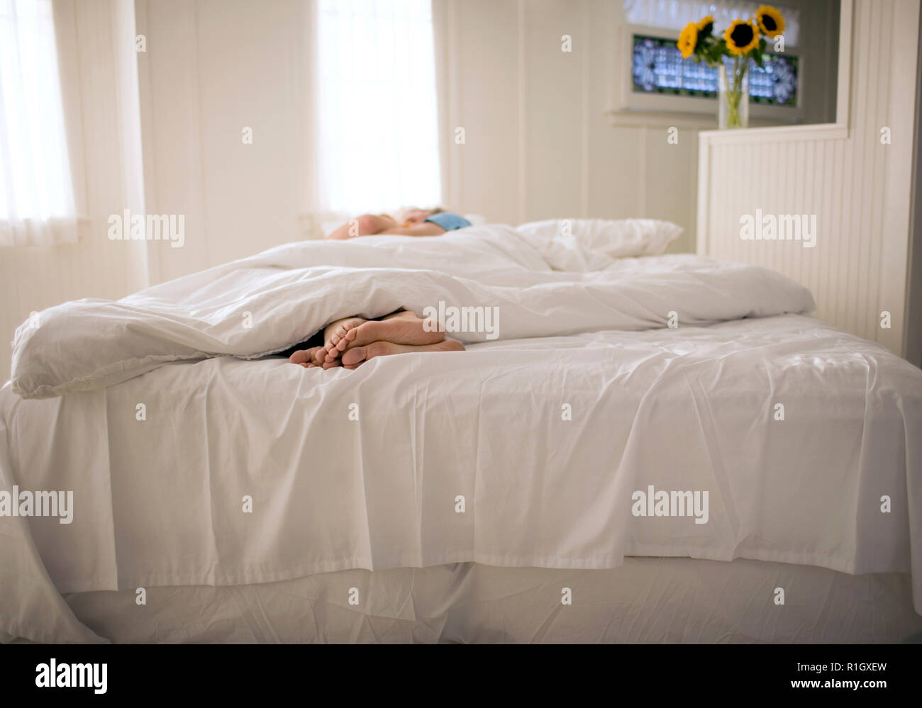 Two People Sleeping In Bed