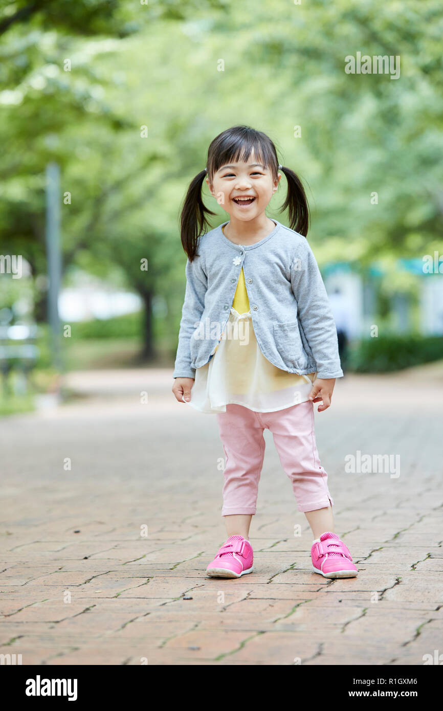 Japanese kid in a city park Stock Photo - Alamy
