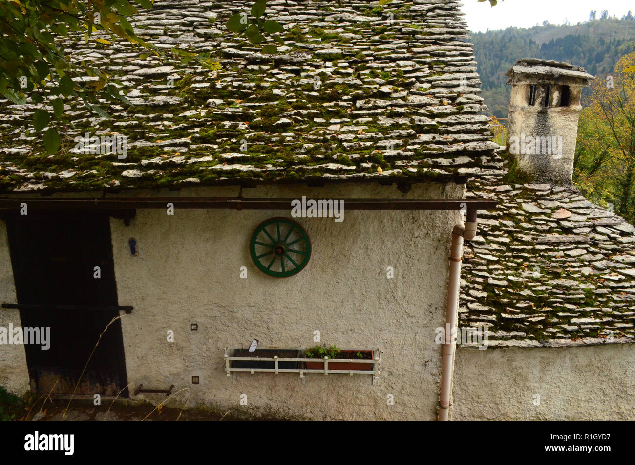 Cute little building with a rock roof Stock Photo - Alamy