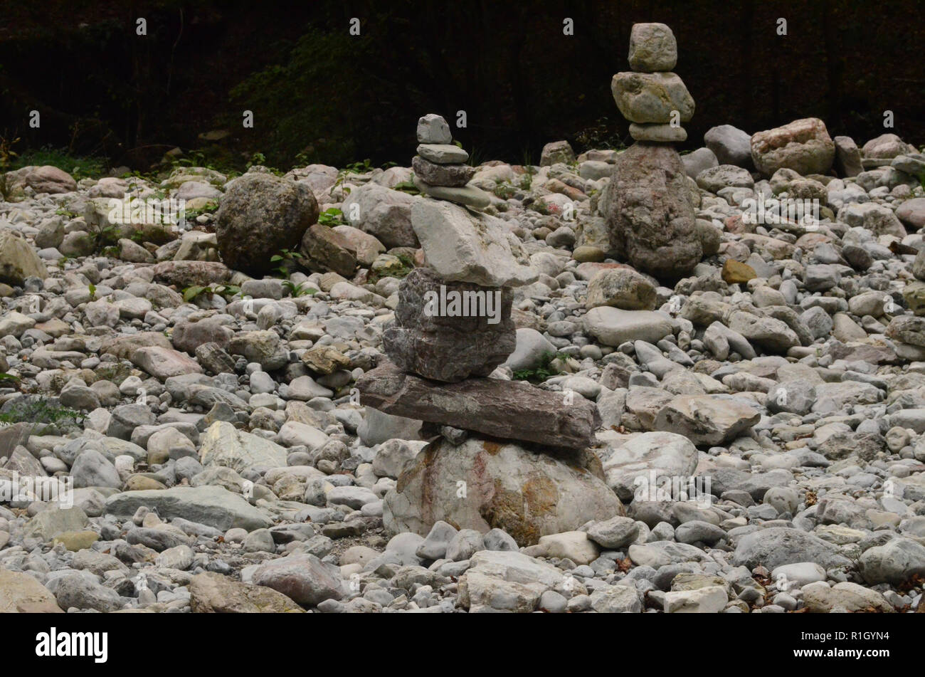 Two stacks of rocks in the woods of Dolomites Stock Photo - Alamy