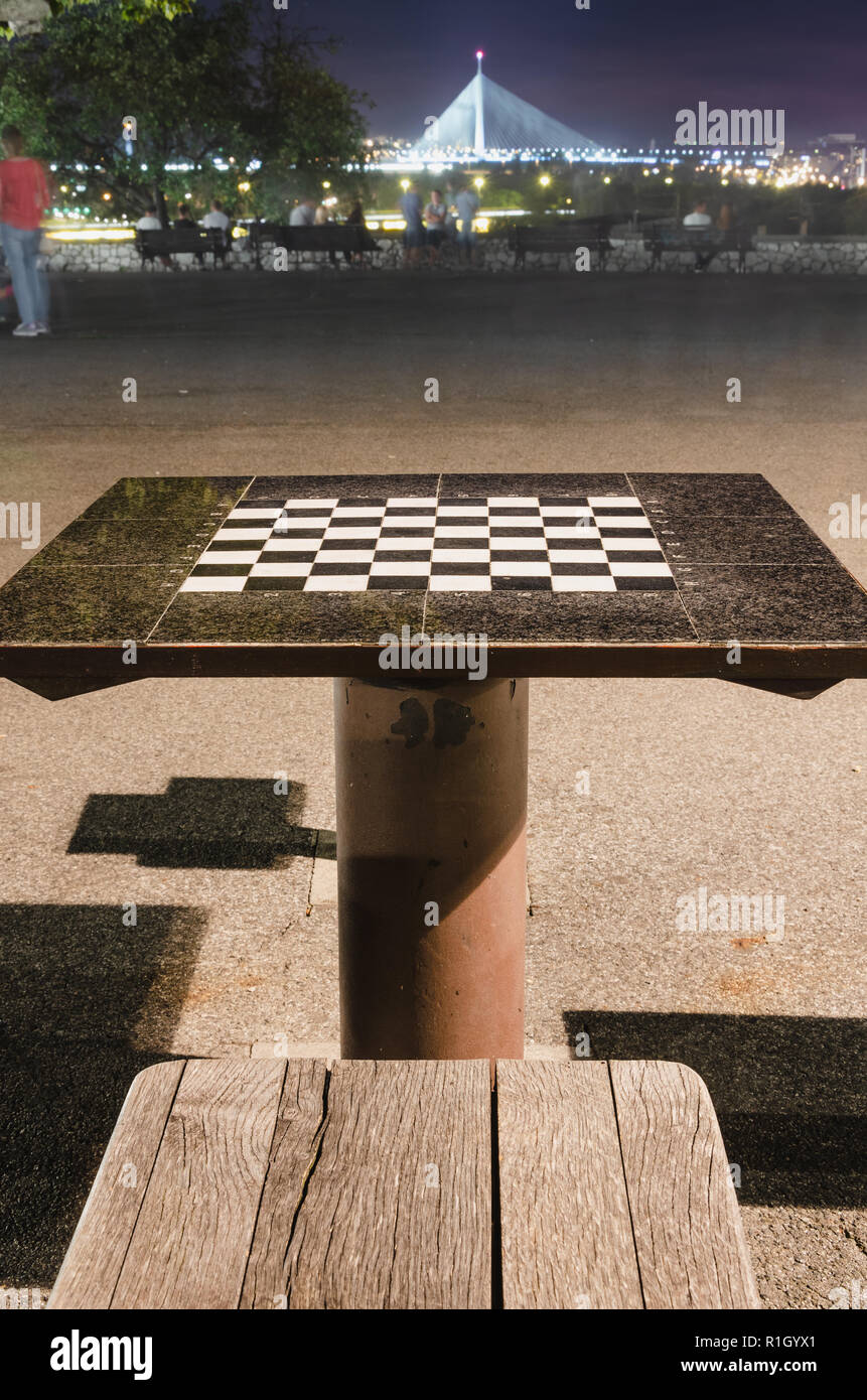 Chess table in the park in the night, big bridge in a distance Stock ...