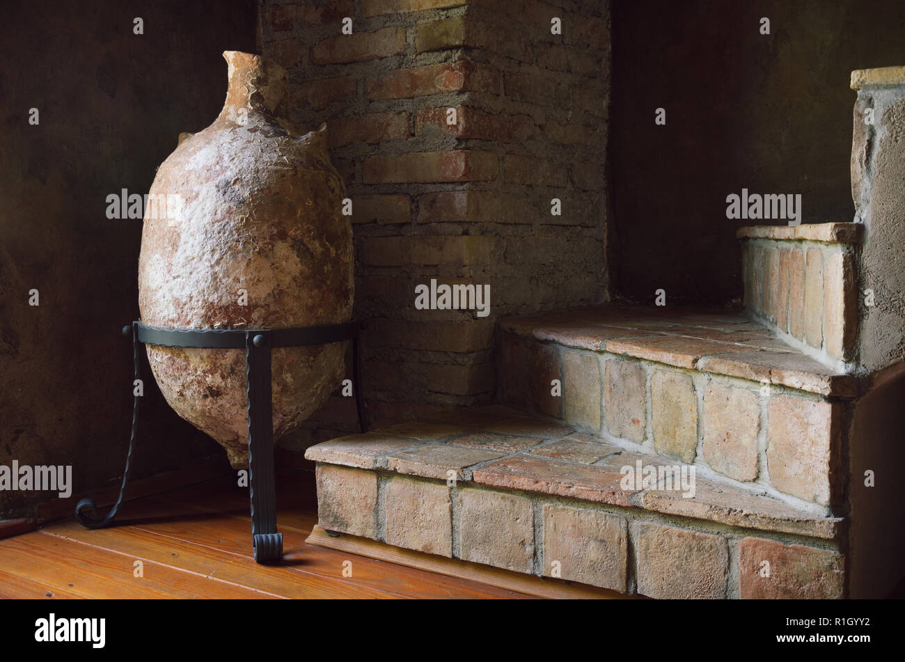 Big ancient roman amphora, jug and old stairways, indoor interior ...