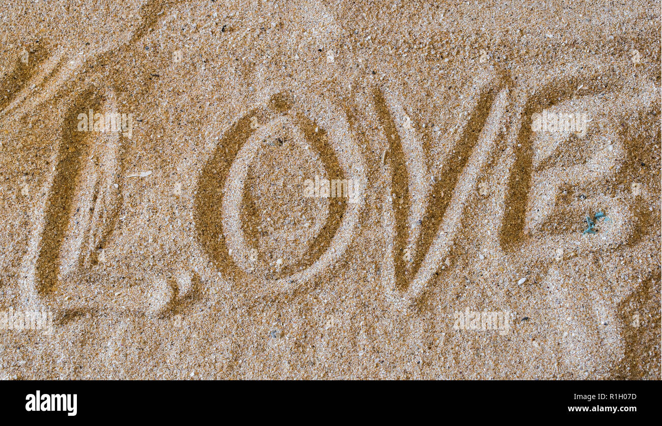 Alphabet writing on sand letter hi-res stock photography and images - Alamy