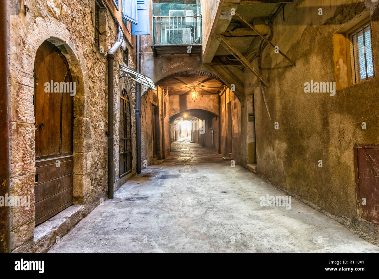 Old houses along narrow cobblestone street in medieval town ...