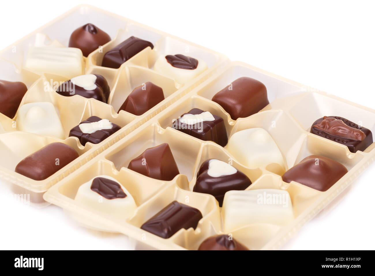 Assortment of chocolate in plastic box Stock Photo - Alamy