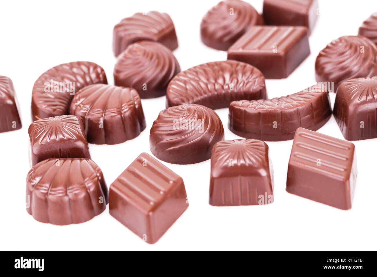 Heap of chocolate on white background Stock Photo - Alamy