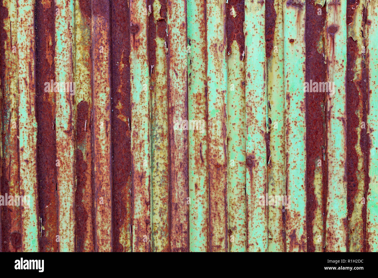 Green rusted metal door with peeling paint Stock Photo - Alamy