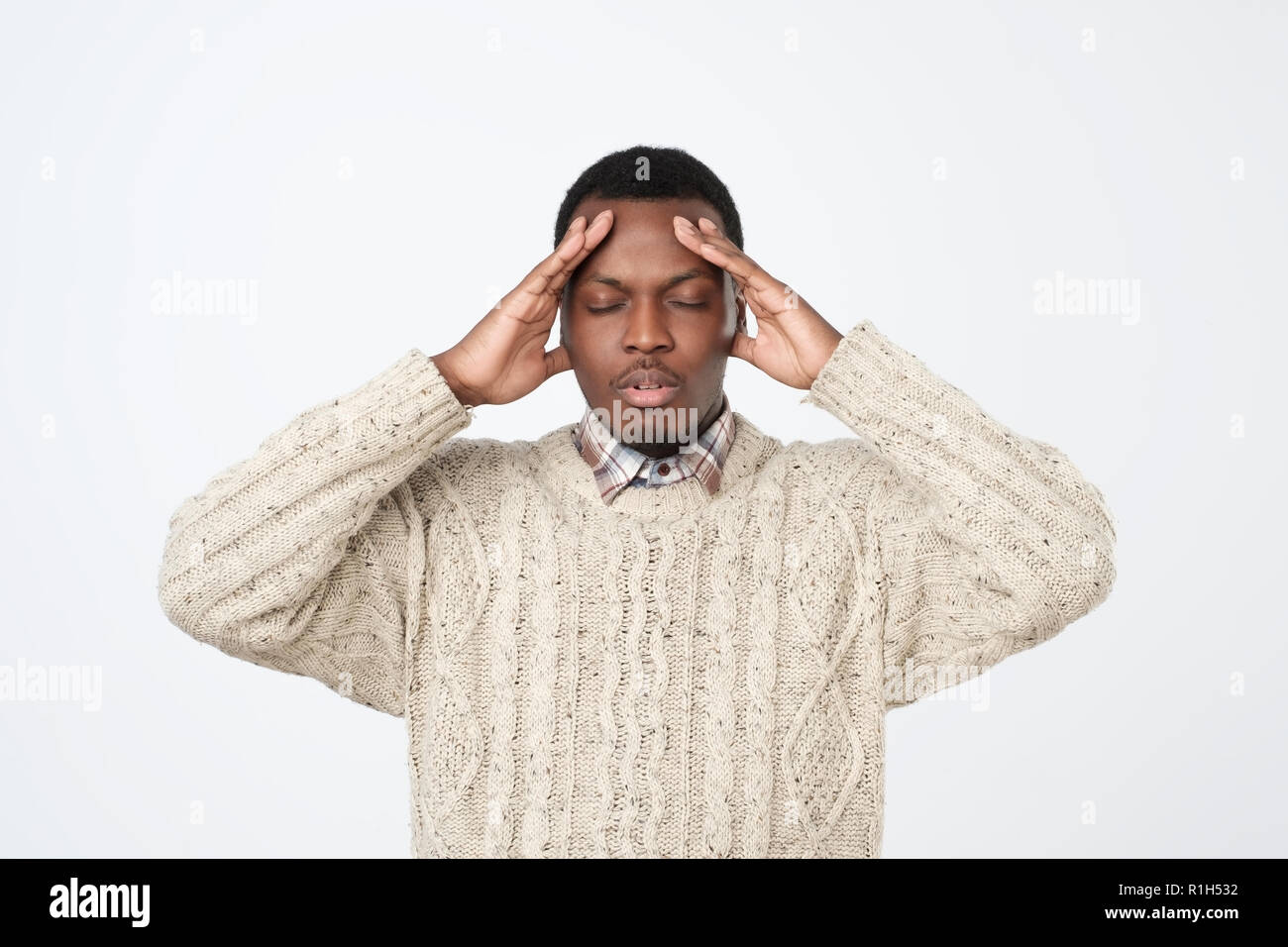 African young man, slapping hand on head having a duh moment isolated ...