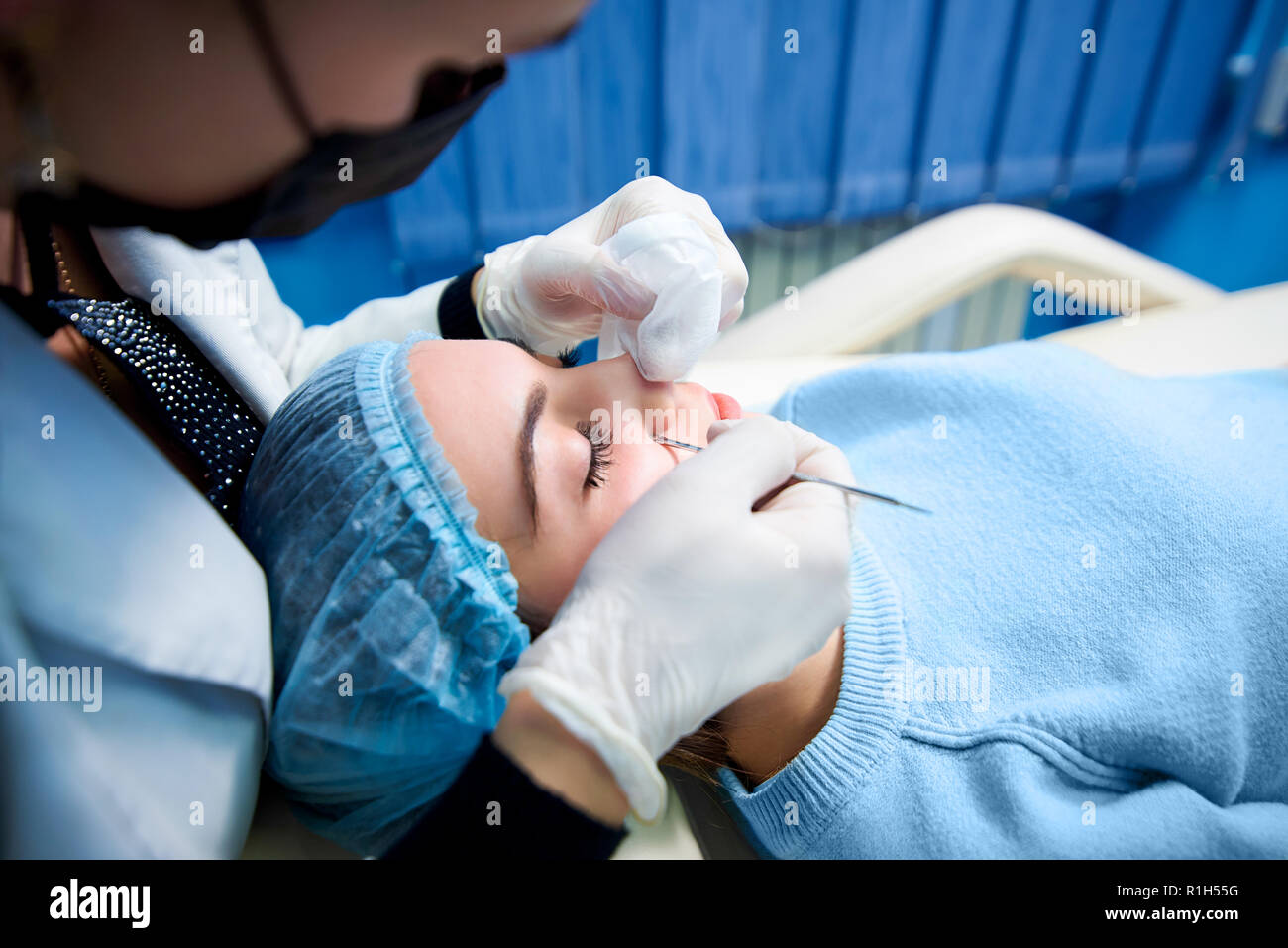 Cosmetic procedures.Cosmetologist at spa beauty salon doing acne ...