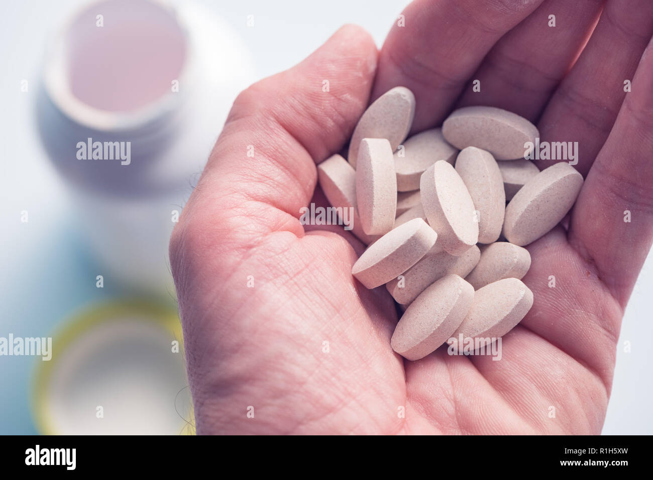 Hand holding vitamins hi-res stock photography and images - Alamy