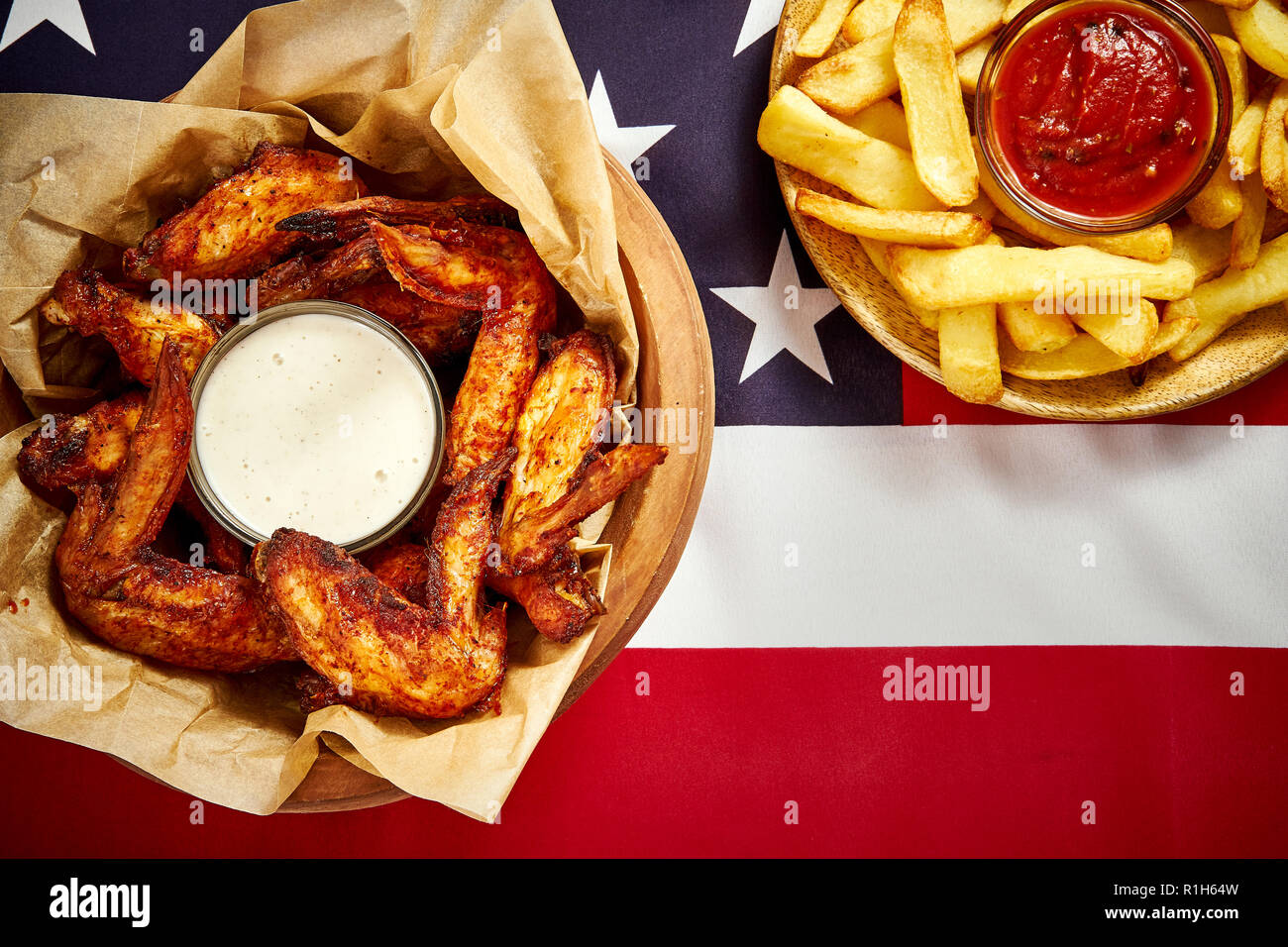 top view of delicious chicken wings and french fries with background of ...