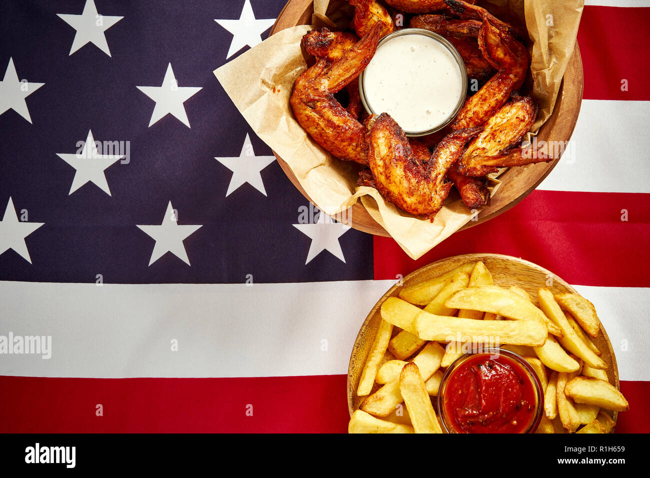 top view of delicious fried chicken wings and french fries with ...