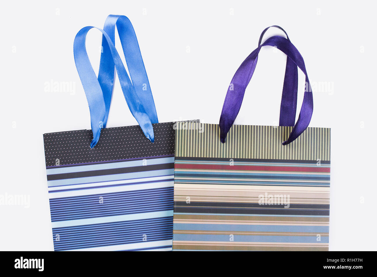 Striped paper bags for shopping Stock Photo - Alamy