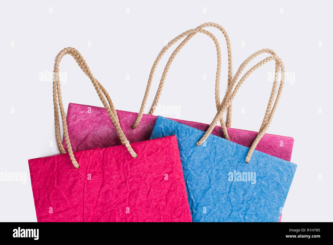 Colorful paper bags for shopping Stock Photo - Alamy