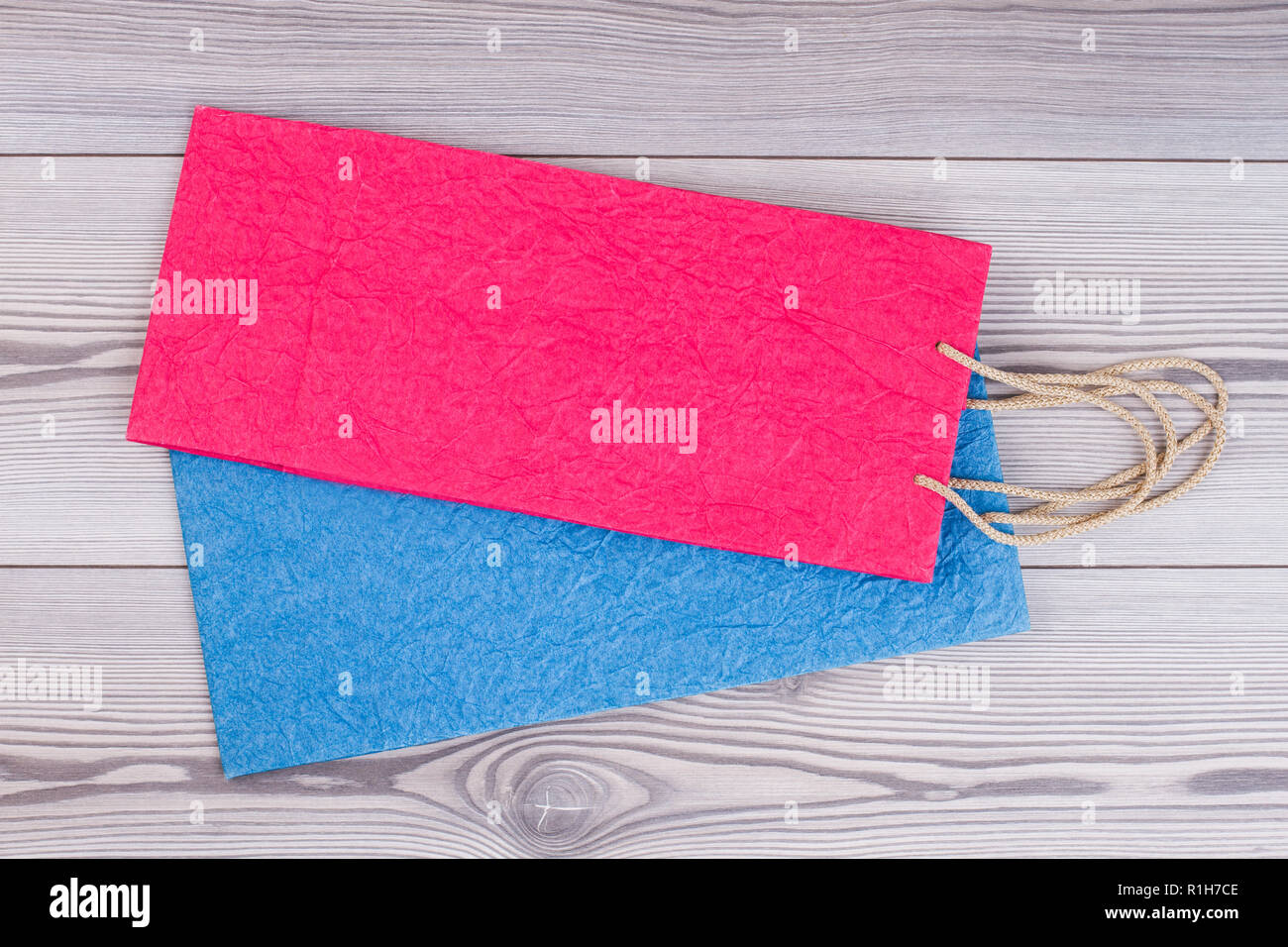 Flat lay colorful paper bags Stock Photo - Alamy