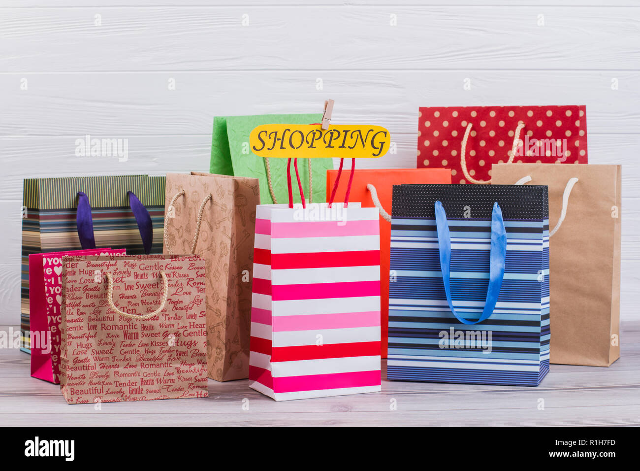 Assorted paper shopping bags background Stock Photo - Alamy