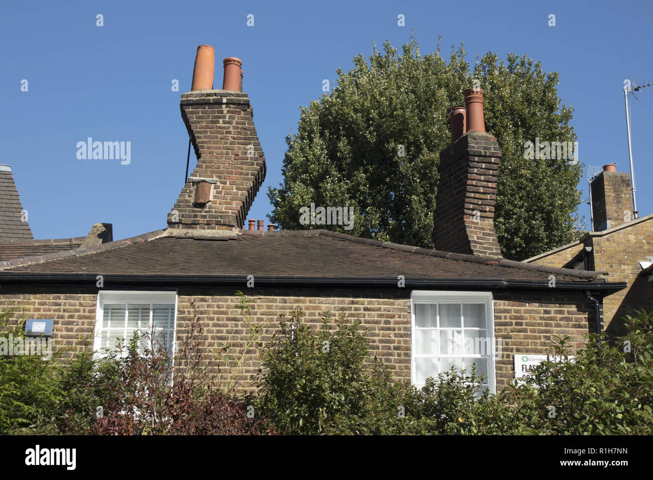 Cottage known for its crooked chimneys in Flask Walk, Hampstead, London ...
